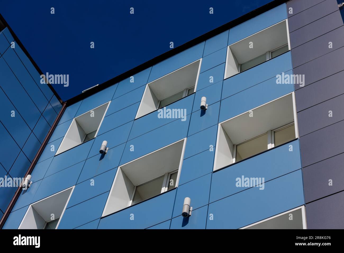 generic blue office building wall with windows and composite aliminium ...