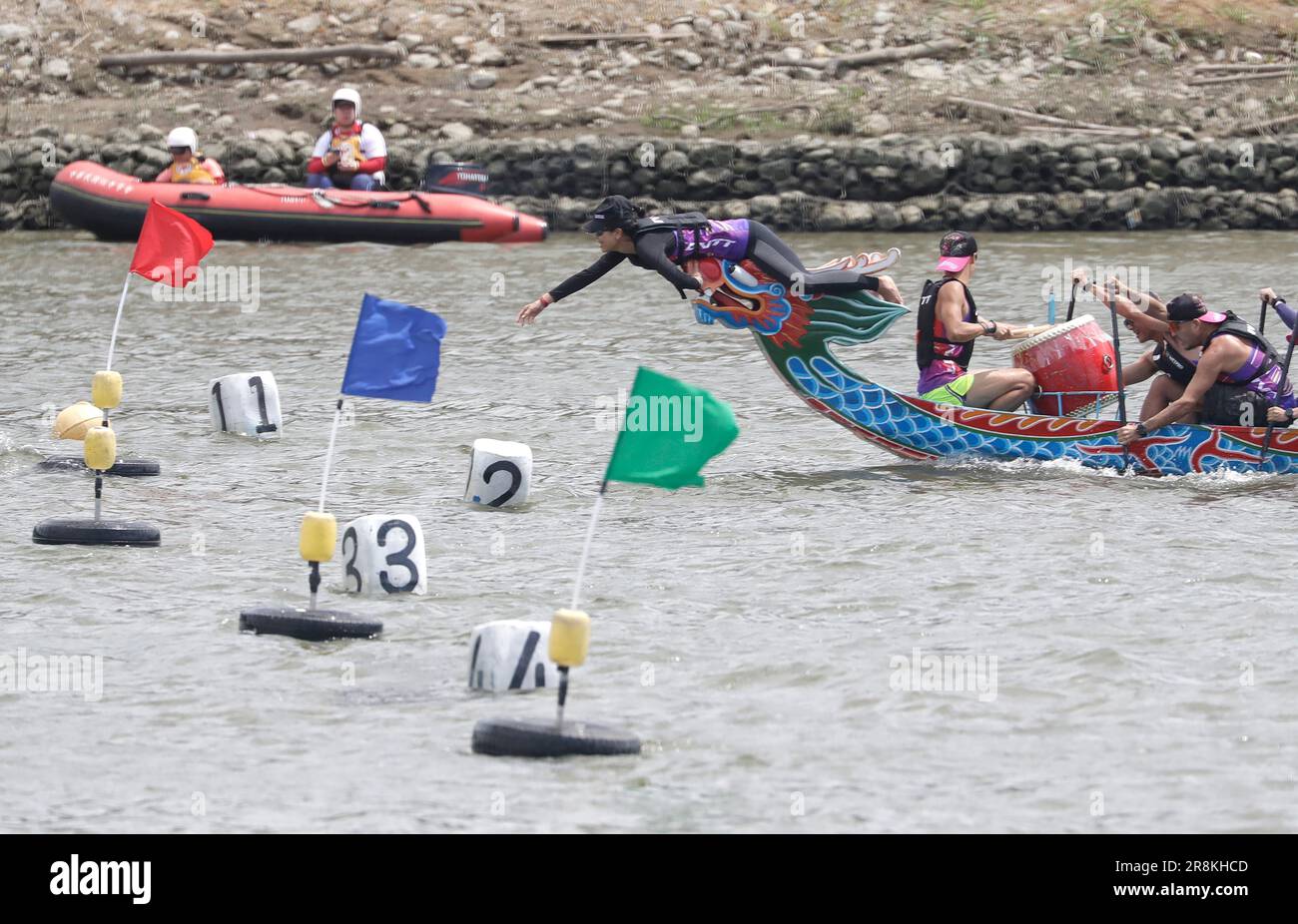Dragon boat crew members participate in a traditional Chinese dragon ...