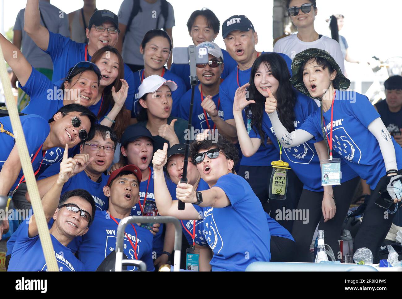 Dragon boat crew members take a selfie during a traditional Chinese ...