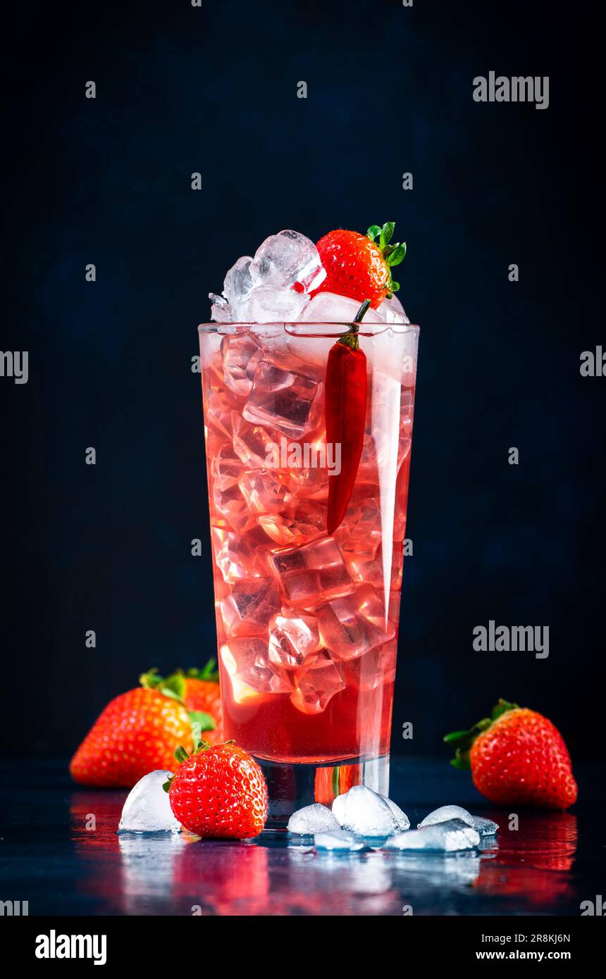 Red alcoholic cocktail drink with vodka, grapefruit juice, strawberries ...