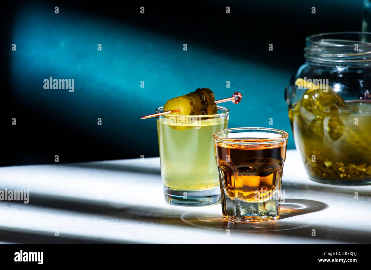 Pickleback, alcoholic cocktail drink from cucumber pickle and whiskey ...