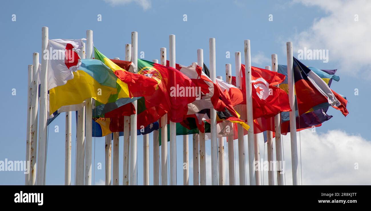 Many national flags against a summer sky Stock Photo - Alamy
