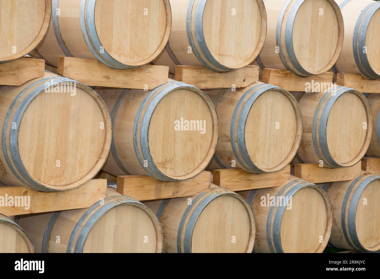 oak barrels lined up in a cellar Bordeaux wine cellars Stock Photo - Alamy