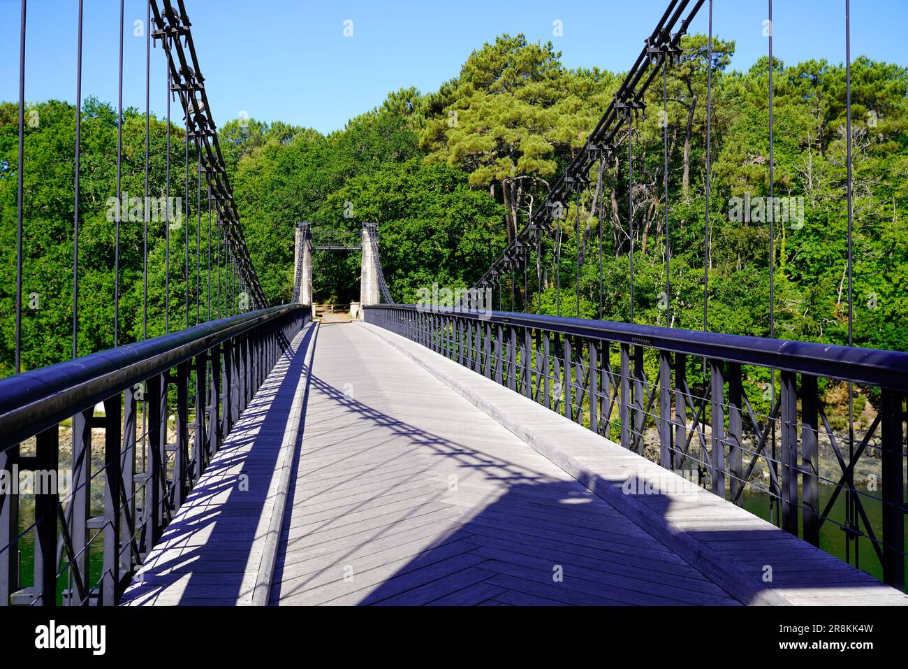 Crossing walkway empty bridge suspended over the river for pedestrians ...