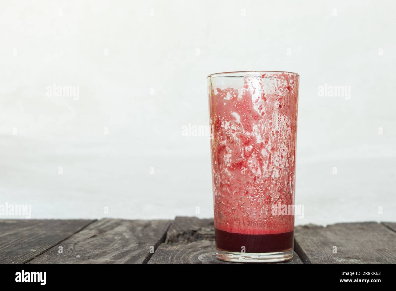a glass of dirty juice stands on the kitchen table Stock Photo - Alamy