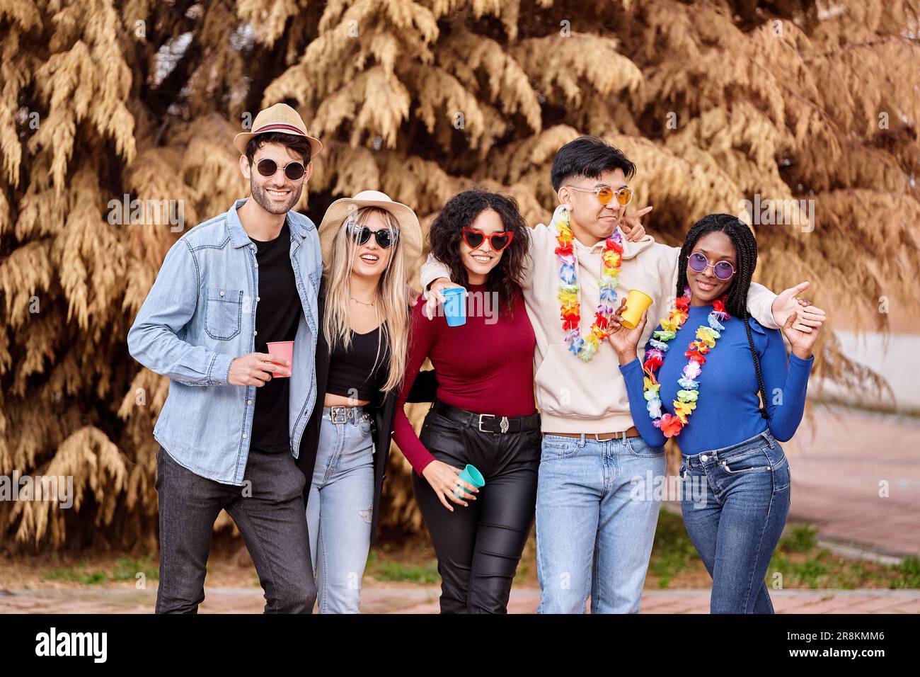 Happy group of multi-ethnic friends having fun while partying at an ...