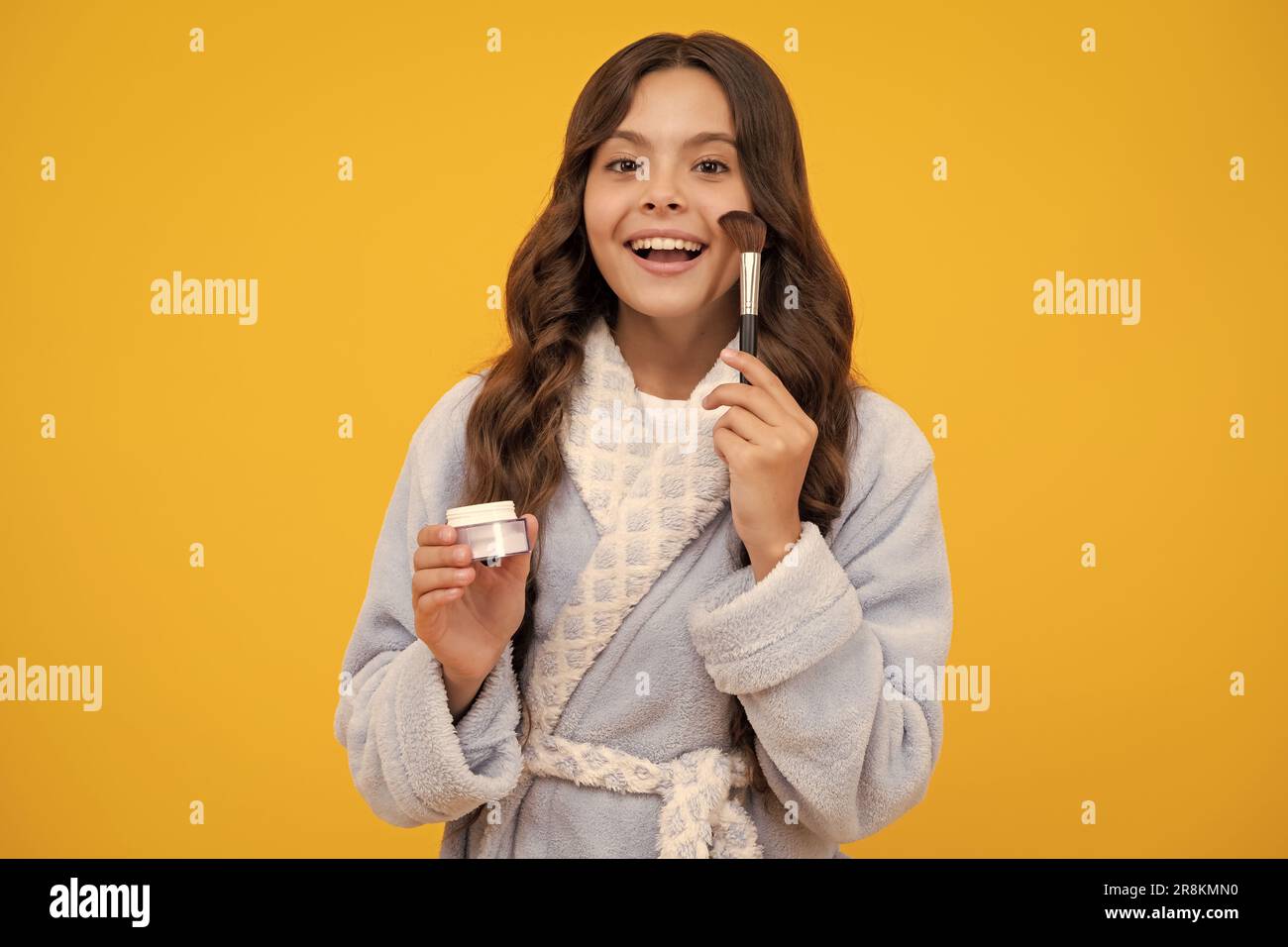 Child girl 12, 13, 14 years old making beauty make up with powder and ...