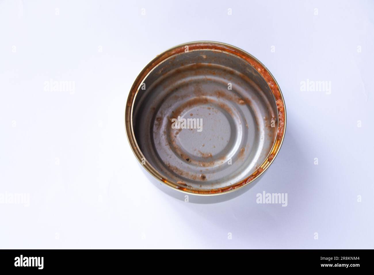 dirty tin can after eaten sprats on a white Stock Photo - Alamy