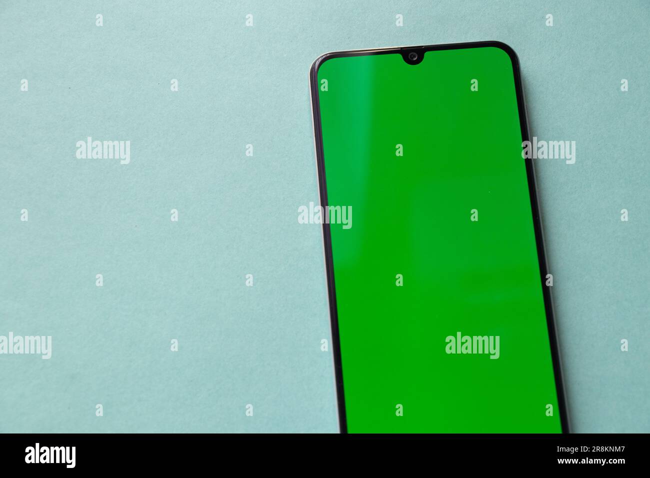 touchscreen phone with green screen on isolated background close-up ...