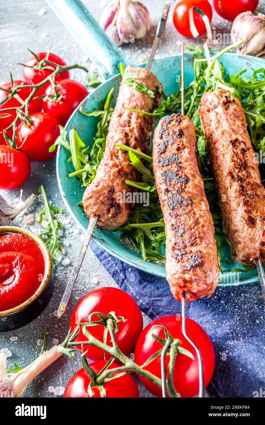 Shish kebab on skewers, from minced beef meat. Lula kebab, traditional ...