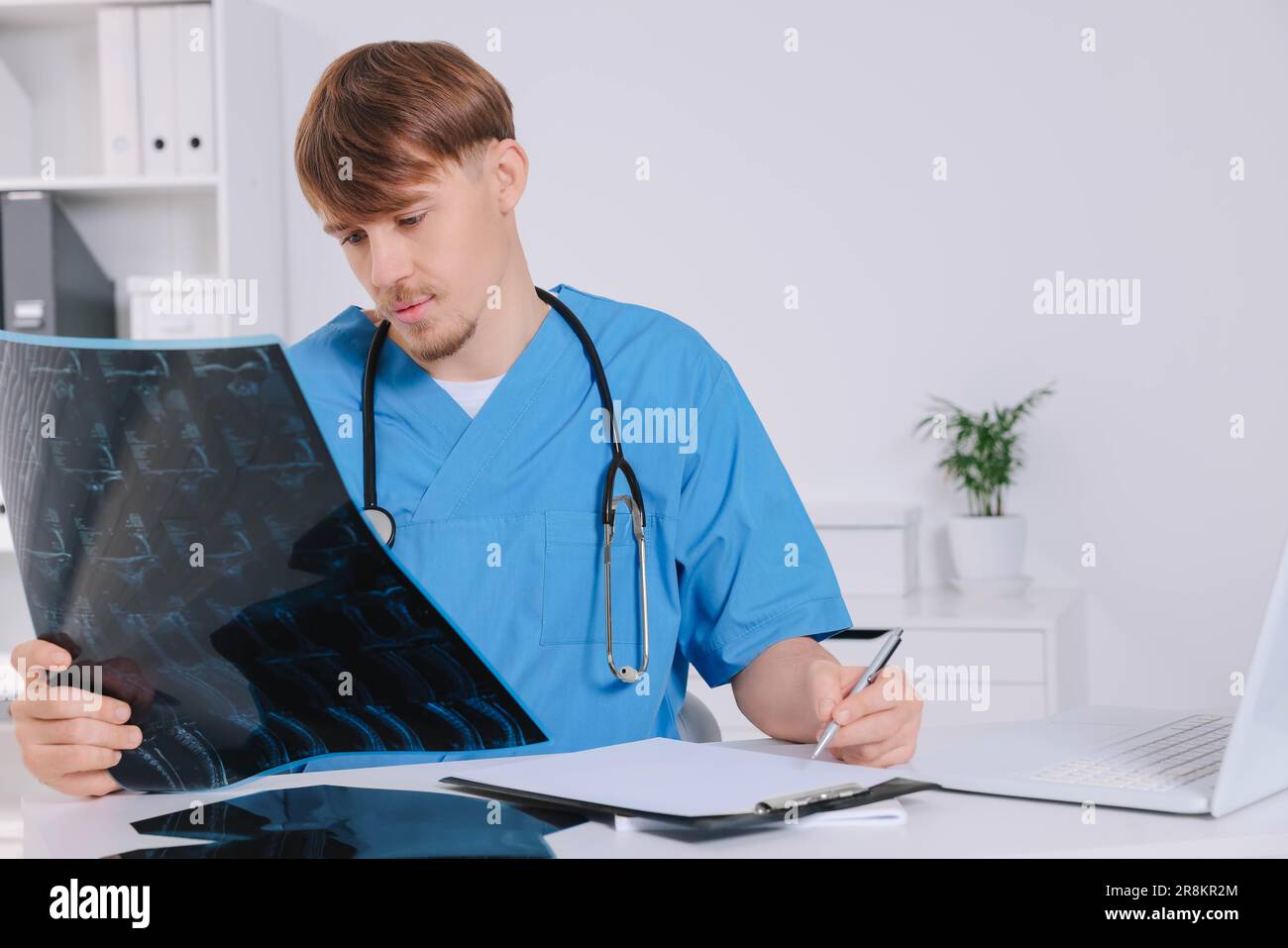 Doctor examining neck MRI image in clinic Stock Photo - Alamy
