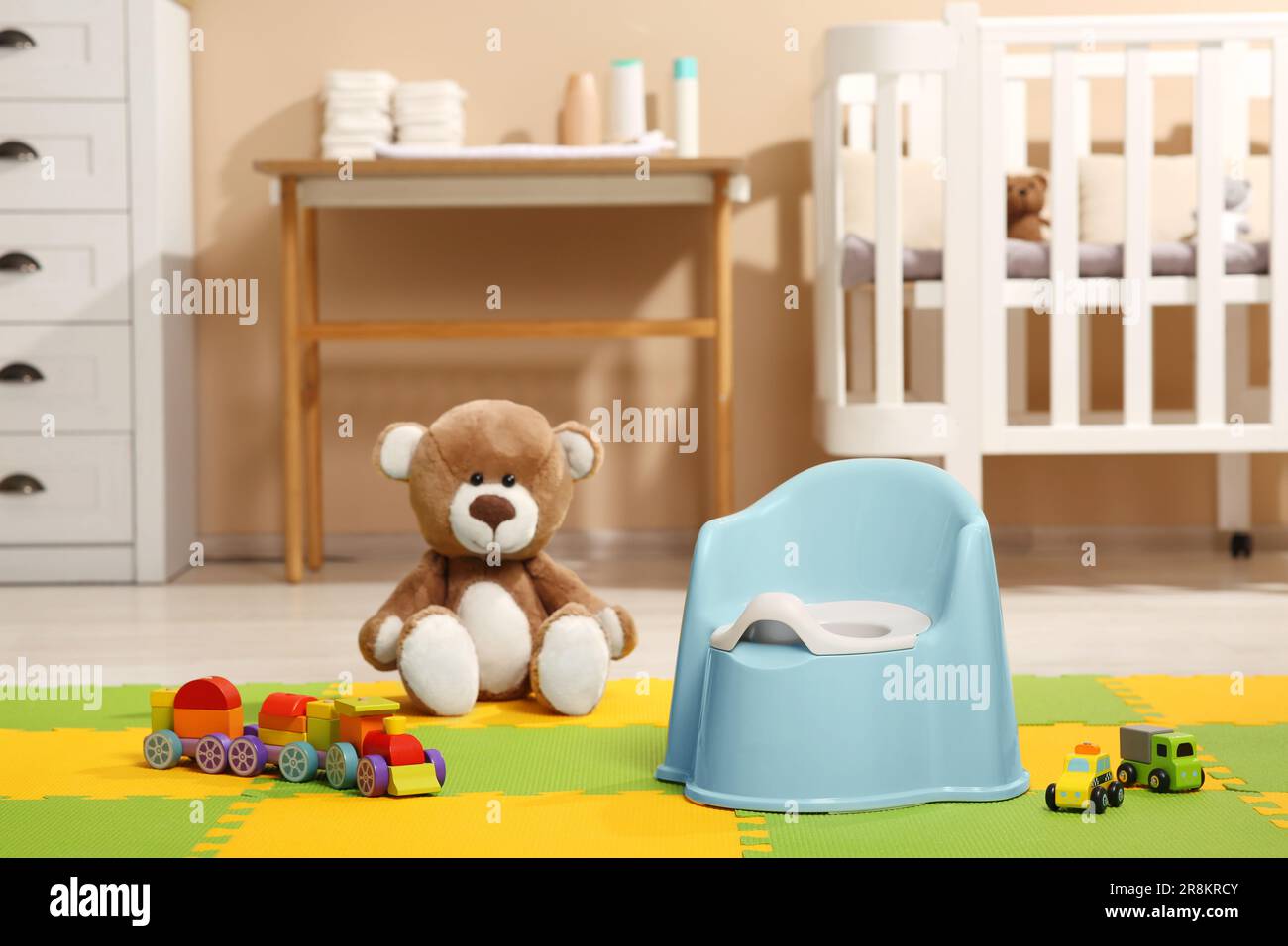 Light blue baby potty and toys in room. Toilet training Stock Photo - Alamy
