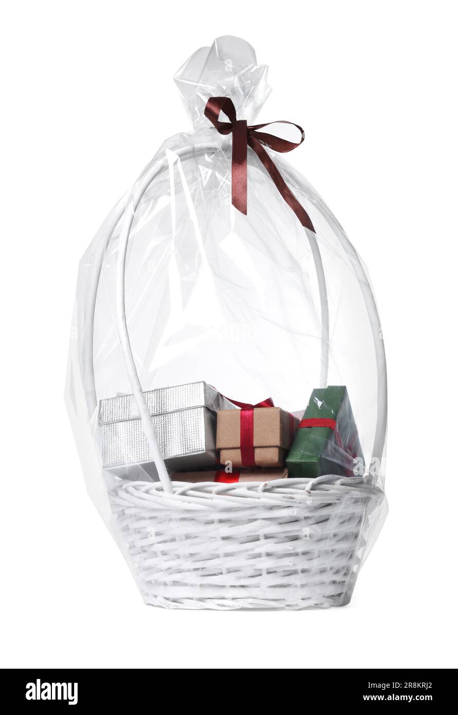 Wicker basket full of gift boxes on white background Stock Photo - Alamy