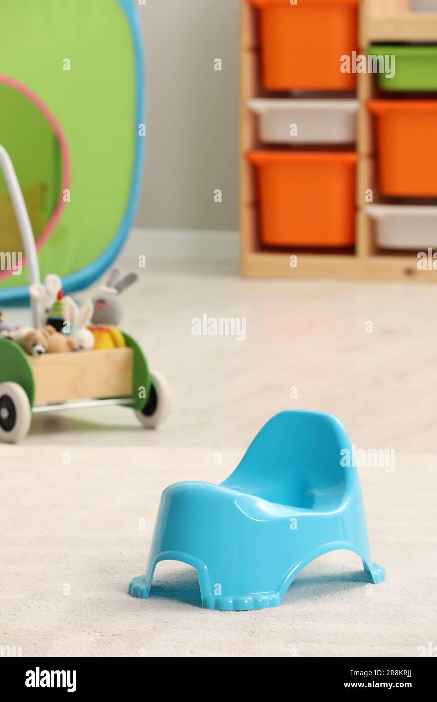 Light blue baby potty in room. Toilet training Stock Photo - Alamy