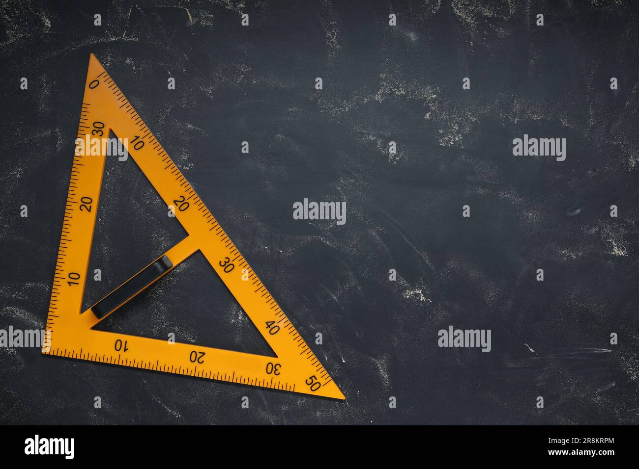 Triangle with measuring length markings on blackboard, top view. Space ...