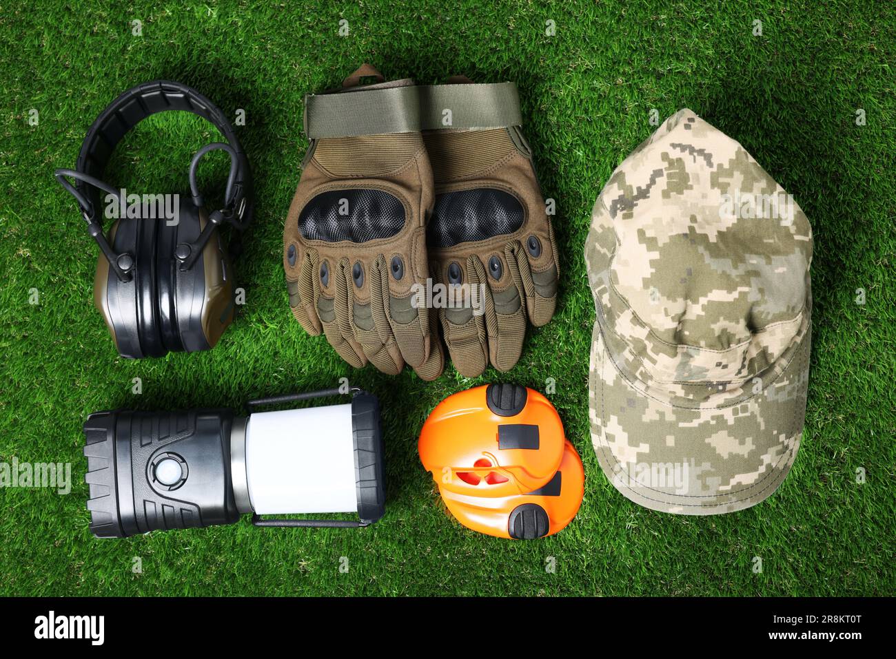 Different military training equipment on green grass, flat lay Stock ...