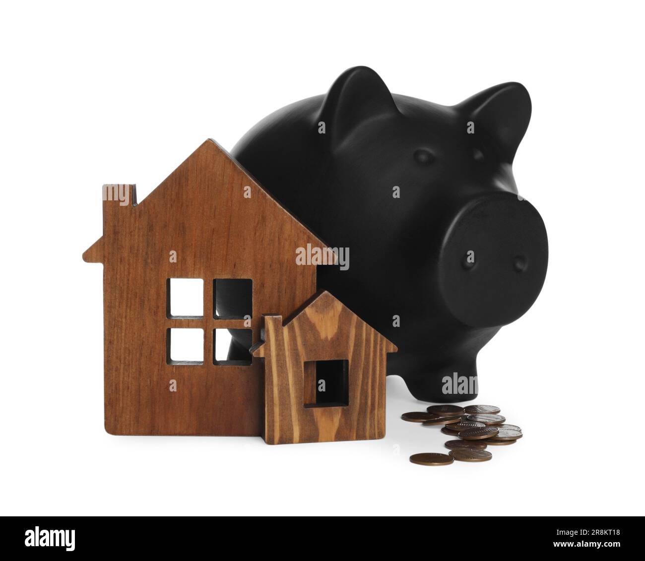 Piggy bank, wooden house models and coins on white background. Saving ...