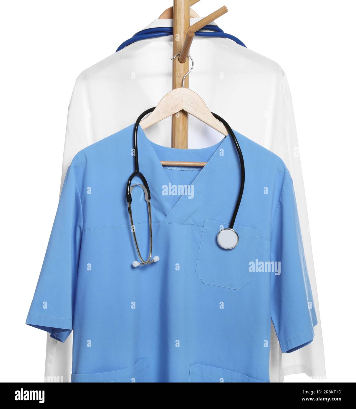 Light blue medical uniform with stethoscope and doctor's gown on rack ...