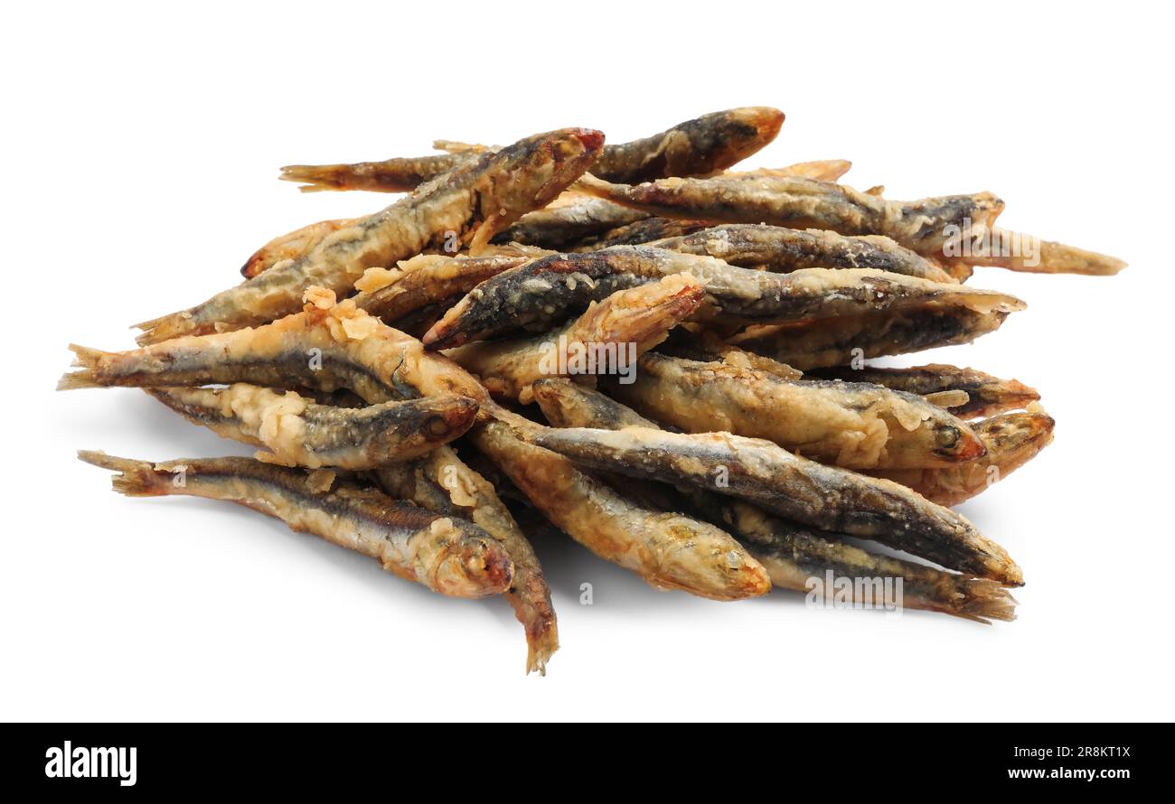 Pile of delicious fried anchovies on white background Stock Photo - Alamy