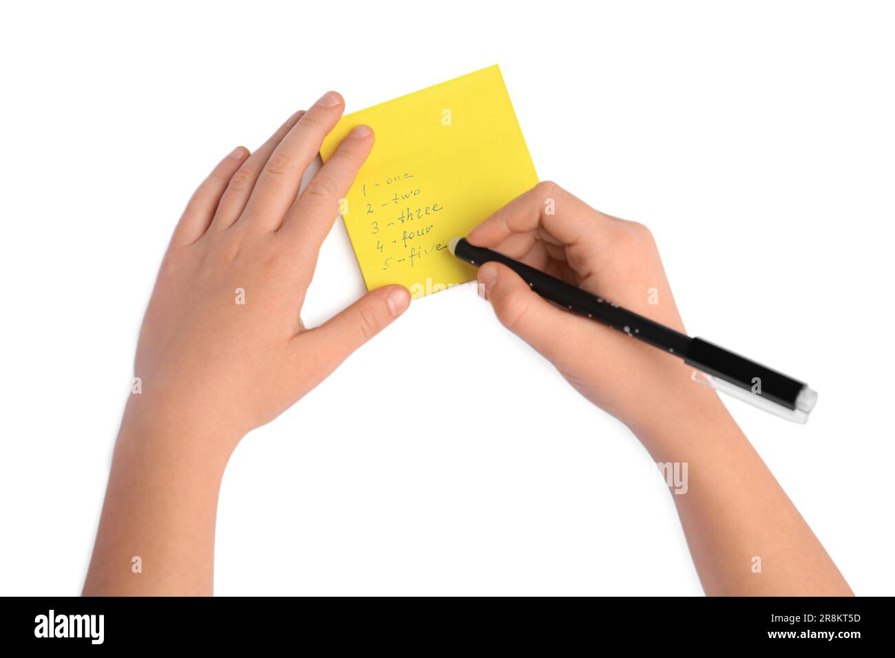 Child erasing word Five written with erasable pen on sticky note ...