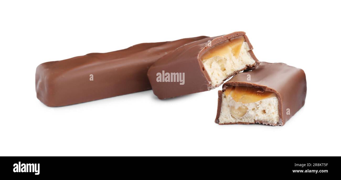 Tasty chocolate bars with caramel on white background Stock Photo - Alamy