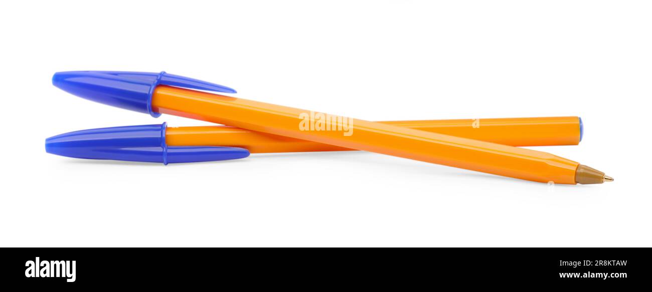 New orange plastic pens isolated on white Stock Photo - Alamy