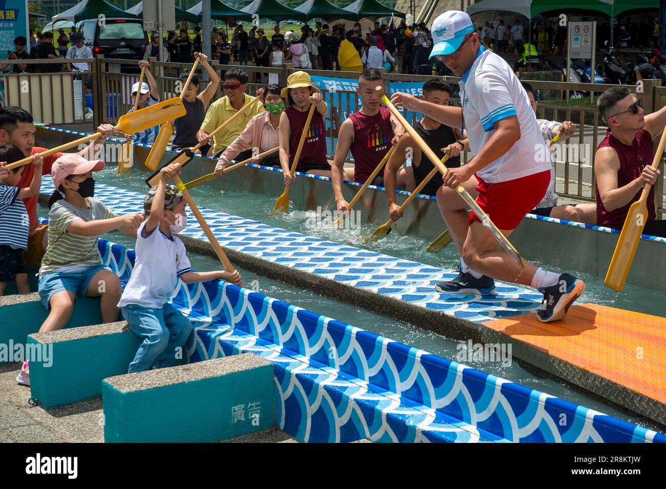 Instructor shows spectators how to paddle during a brake in a ...