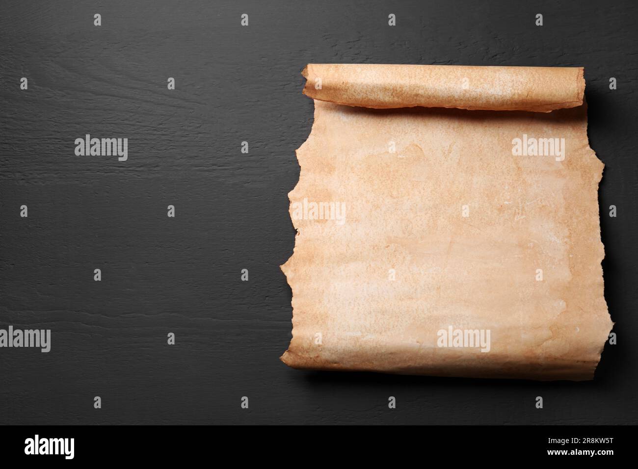Sheet of old parchment paper on light grey wooden table, top view ...