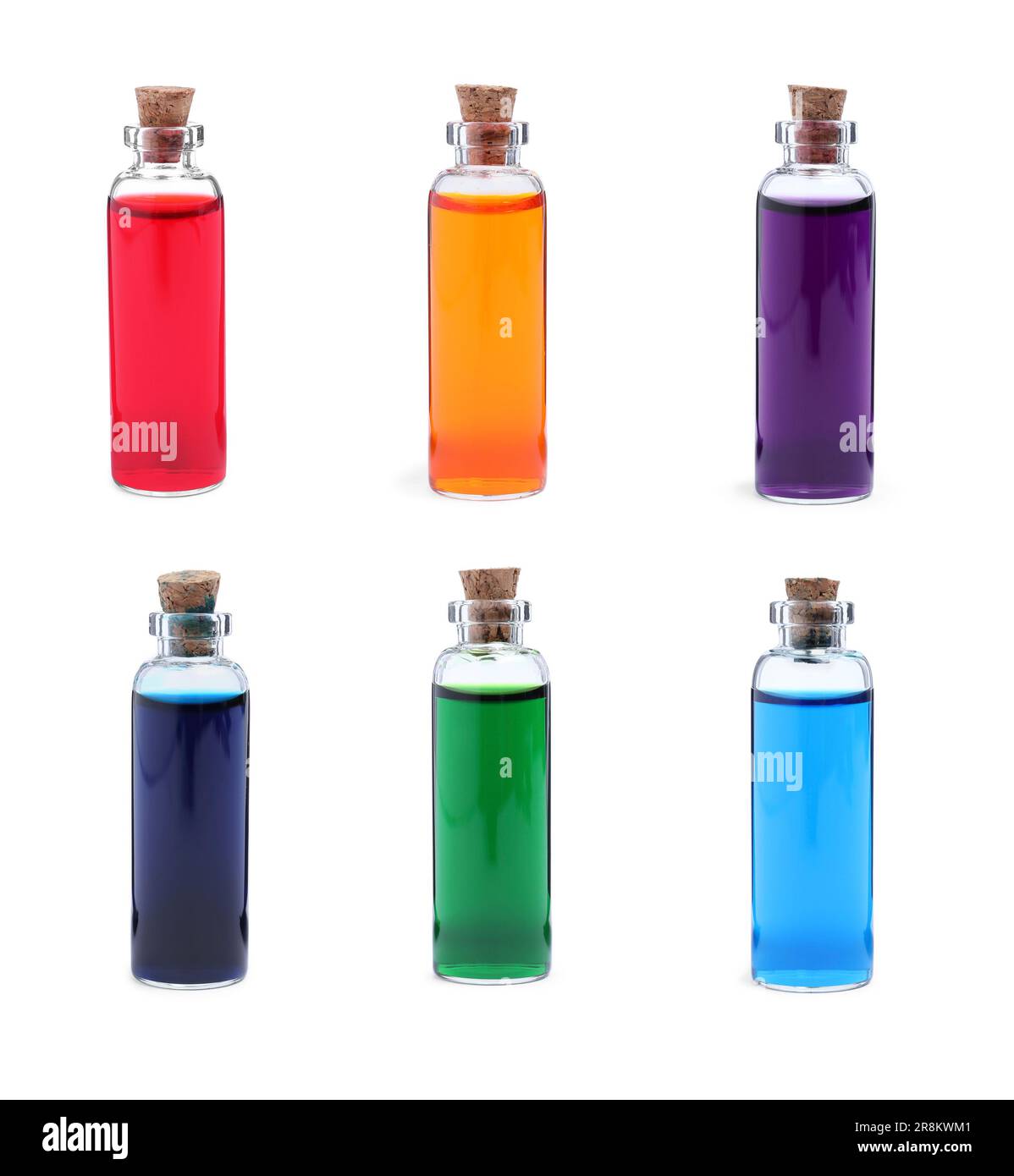Collage of glass bottles with different food coloring isolated on white ...