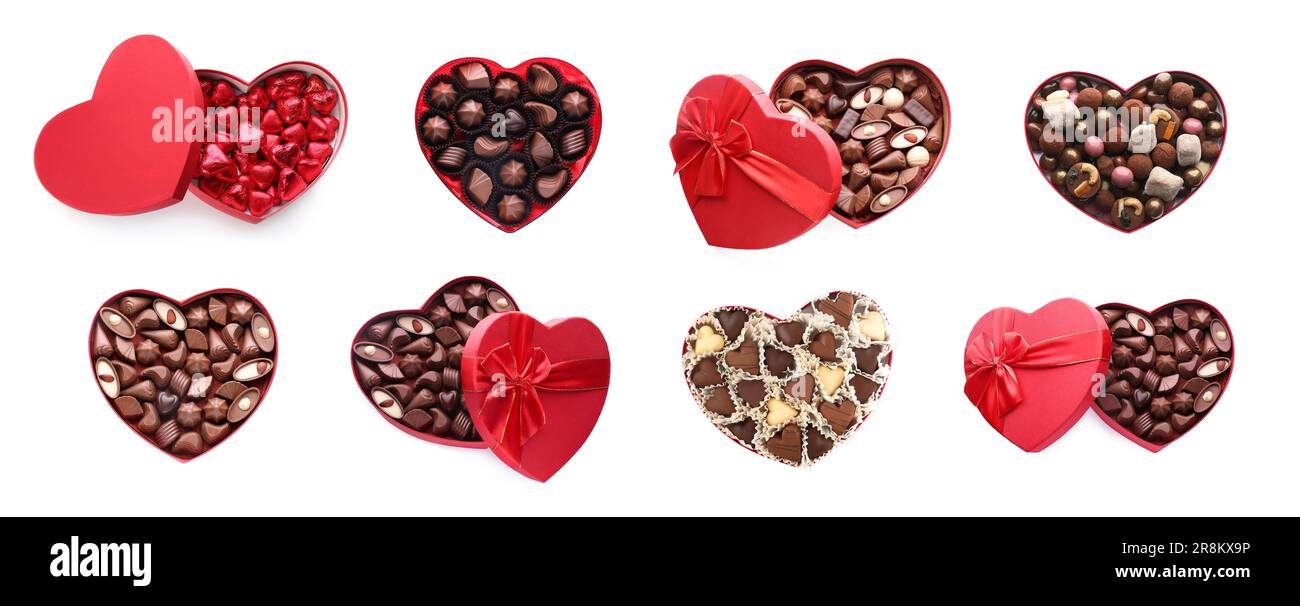 Many heart shaped boxes with tasty chocolate candies on white ...