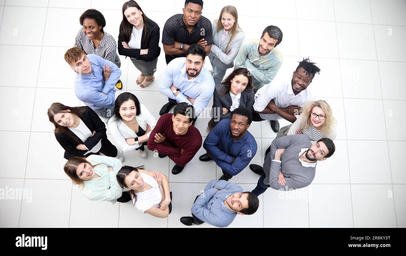 large group of diverse young people looking up hopefully Stock Photo ...