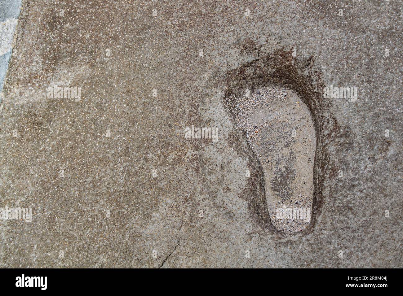 Deep right shoe print on the concrete floor of a street Stock Photo - Alamy