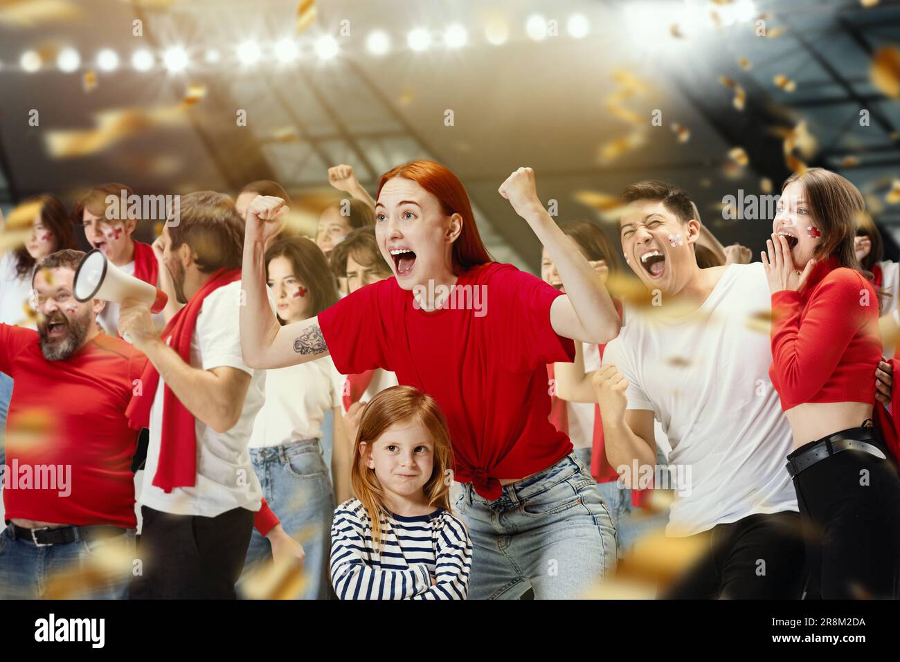 Young expressive woman cheering up favourite football team with sport ...