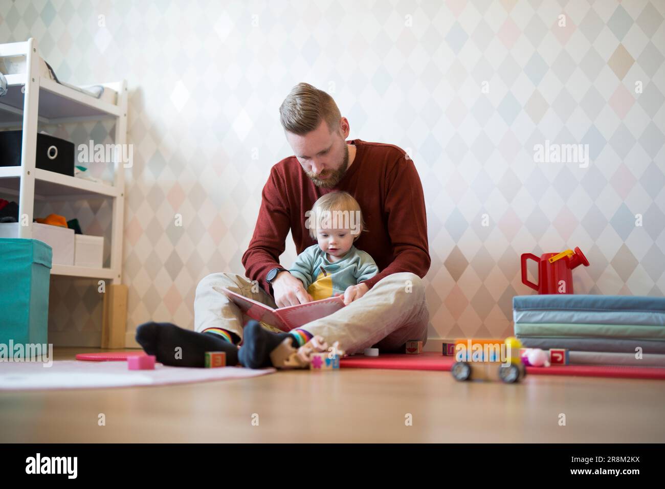 Father reading book to child with down syndrome Stock Photo - Alamy