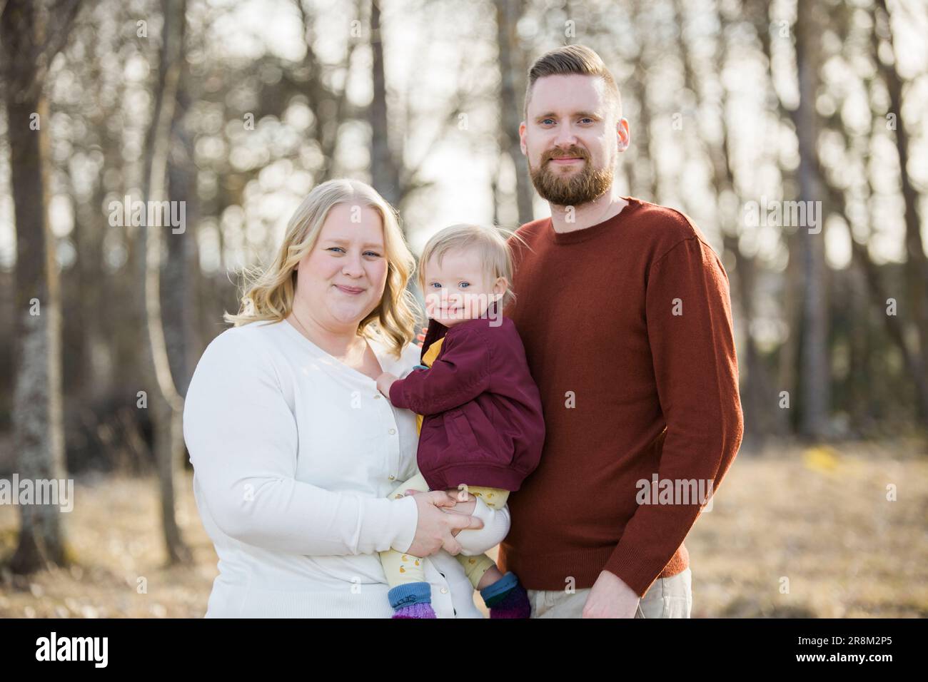 Outdoor portrait of family with baby with down syndrome Stock Photo - Alamy