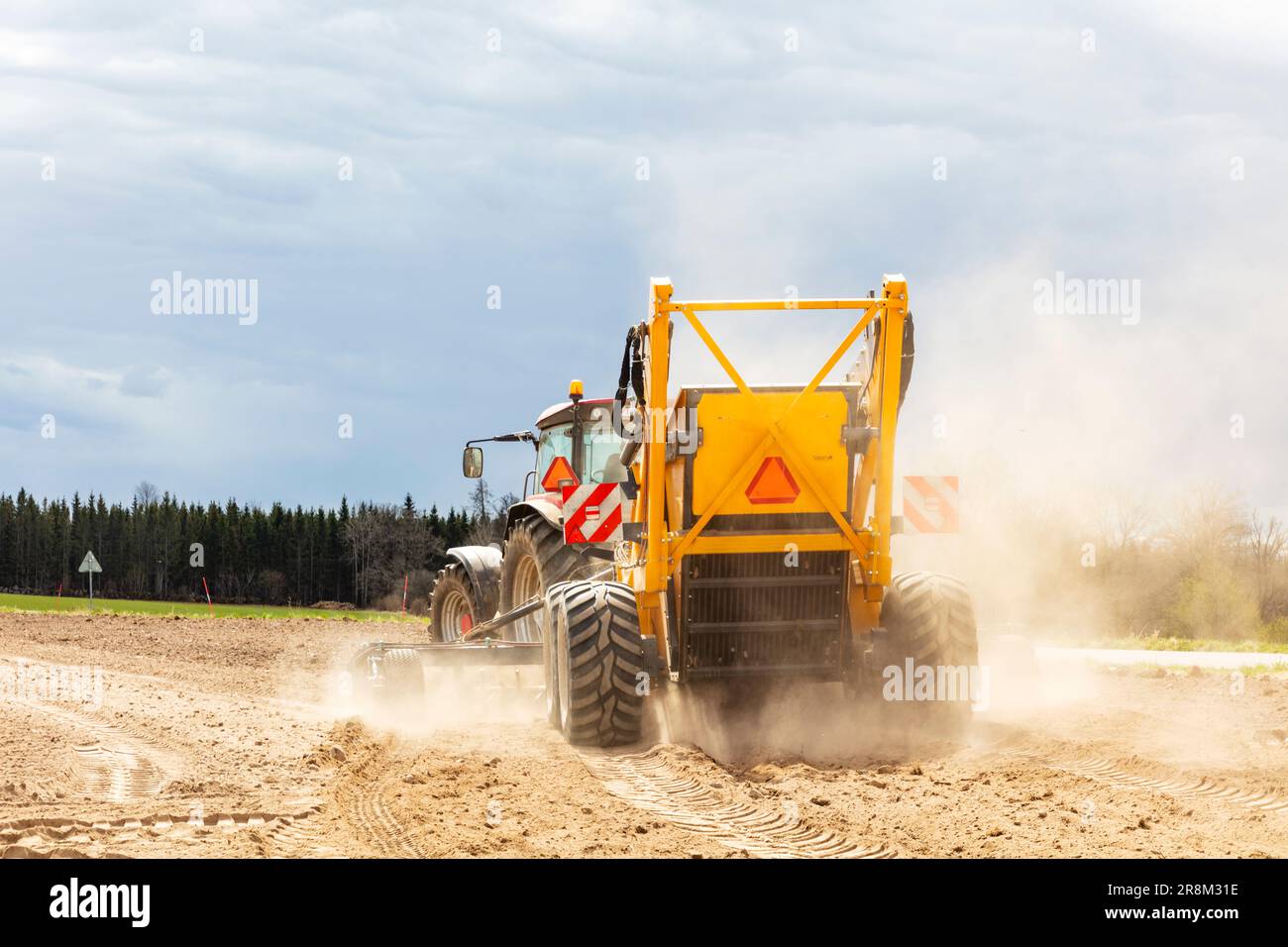 Tractor plowing field in farm Stock Photo - Alamy
