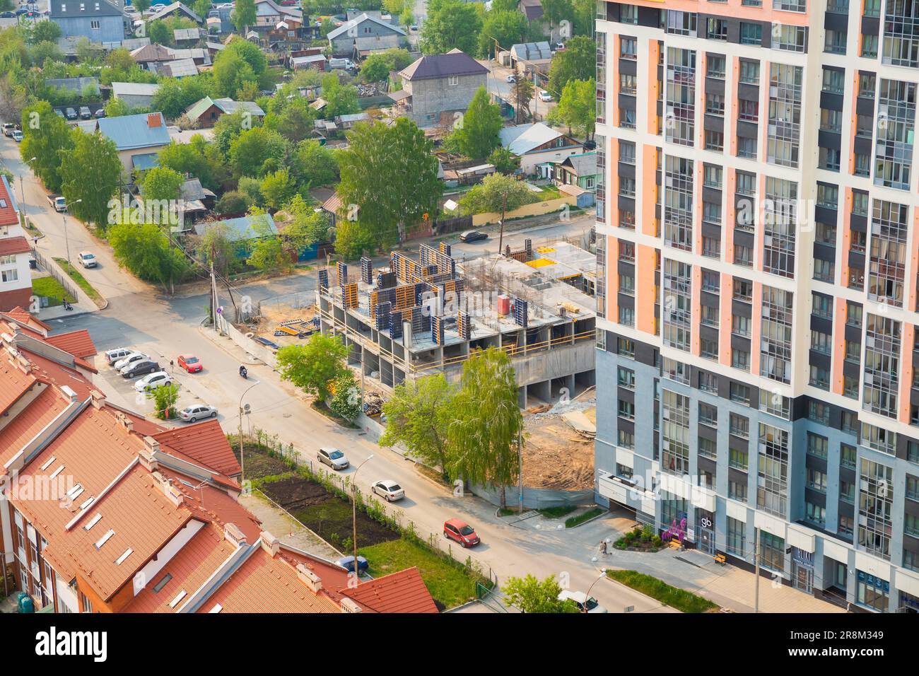 city quarter, building under construction, townhouses, tower modern ...