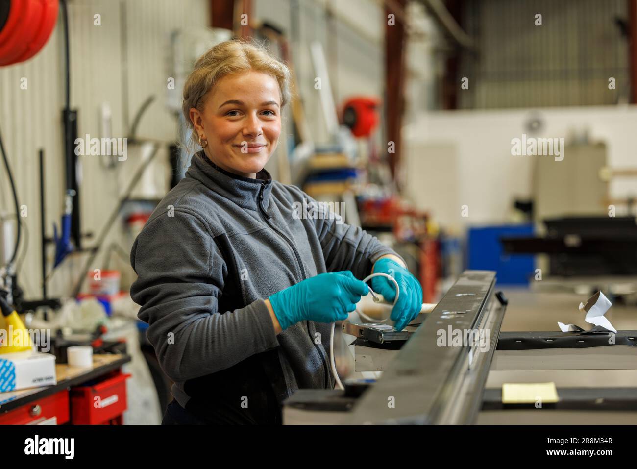 Young female worker industrial hi-res stock photography and images - Alamy