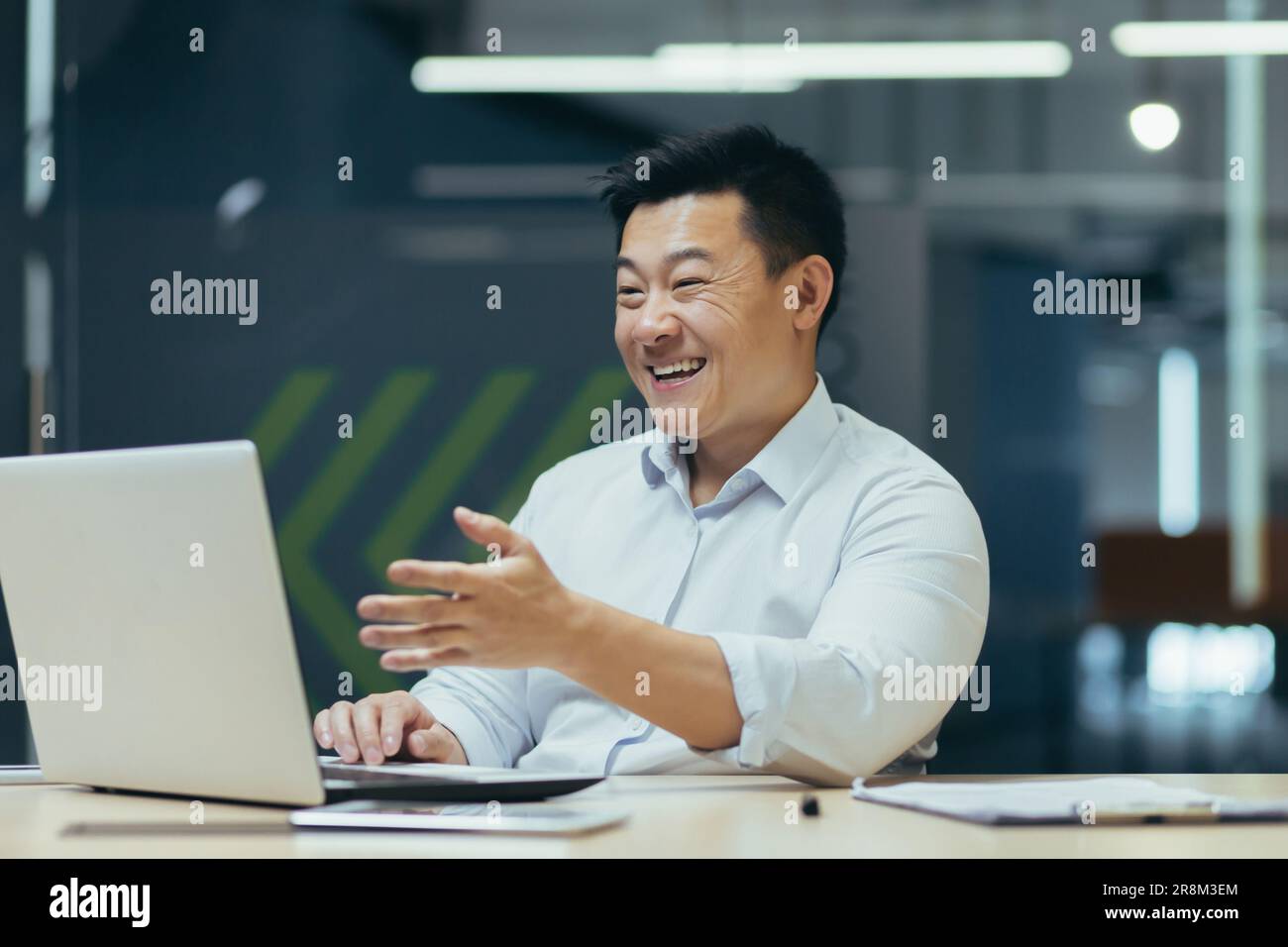 Young Asian male businessman conducts online business meeting ...