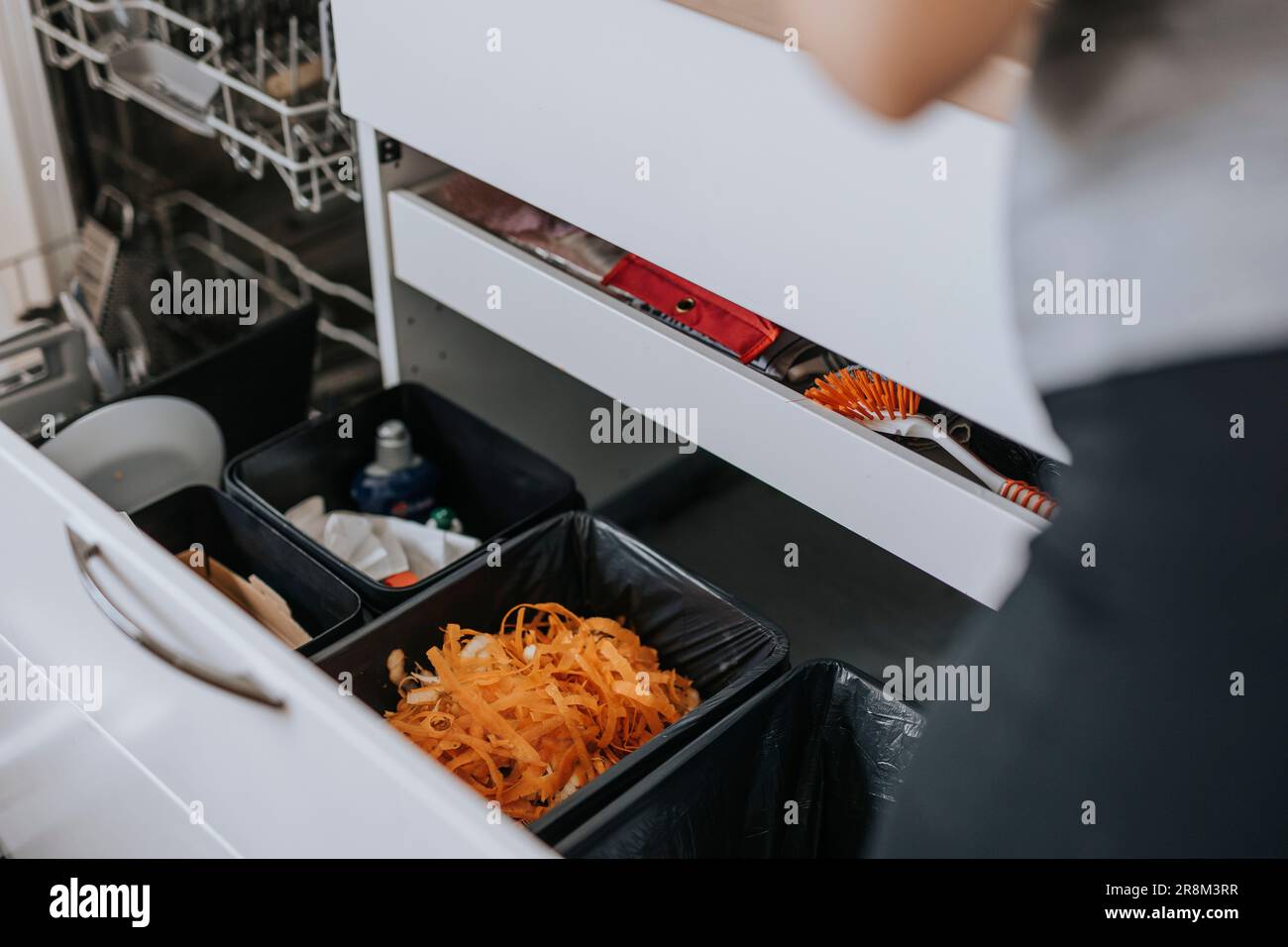 Open draw in kitchen with bins inside Stock Photo - Alamy