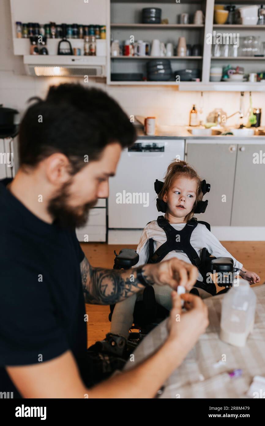 Disabled girl on wheelchair in everyday life hi-res stock photography ...
