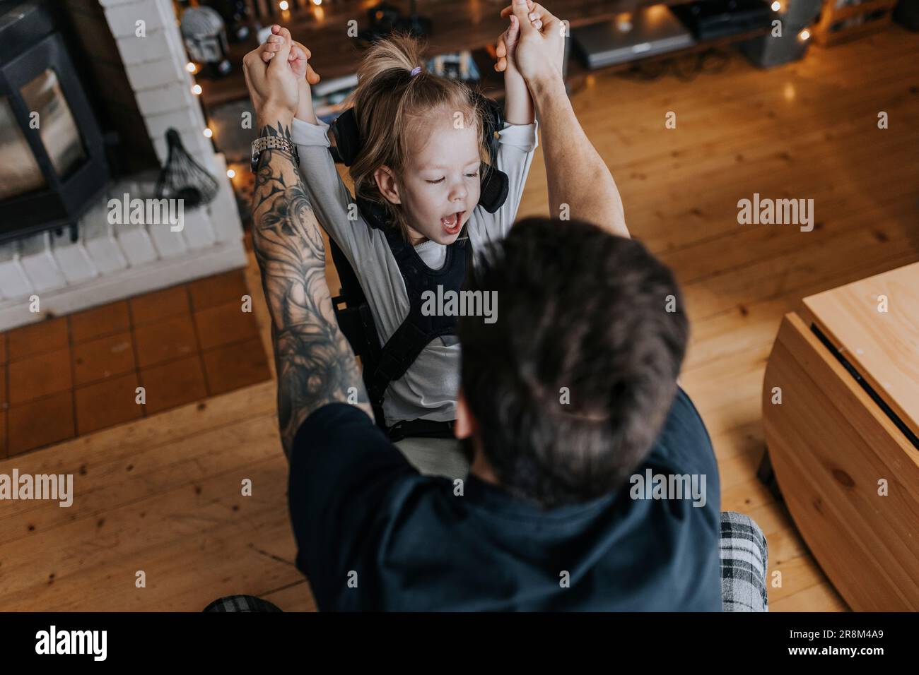 Father playing with disabled child in wheelchair Stock Photo - Alamy