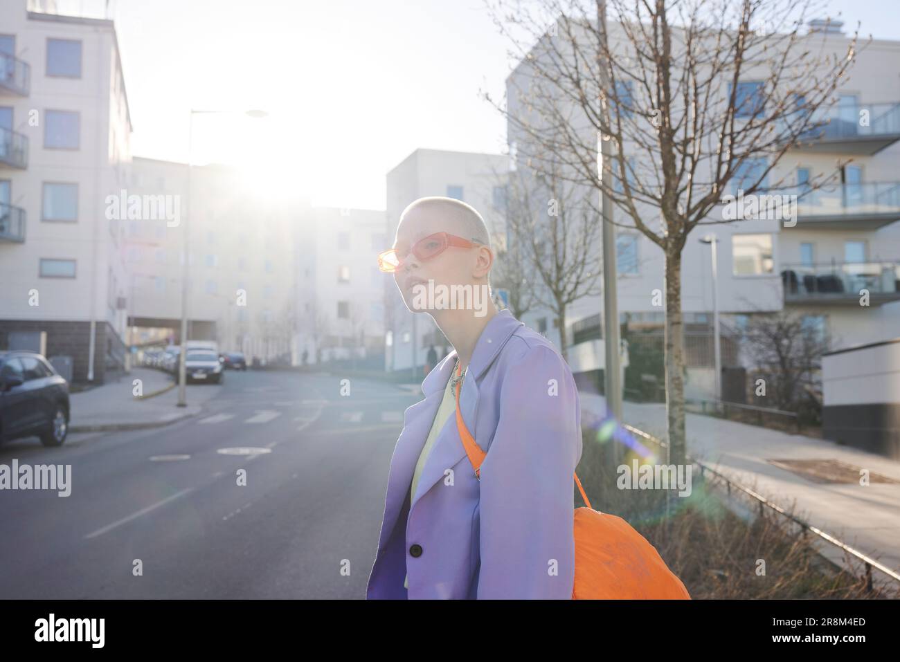 Side view of short-haired woman looking away Stock Photo - Alamy