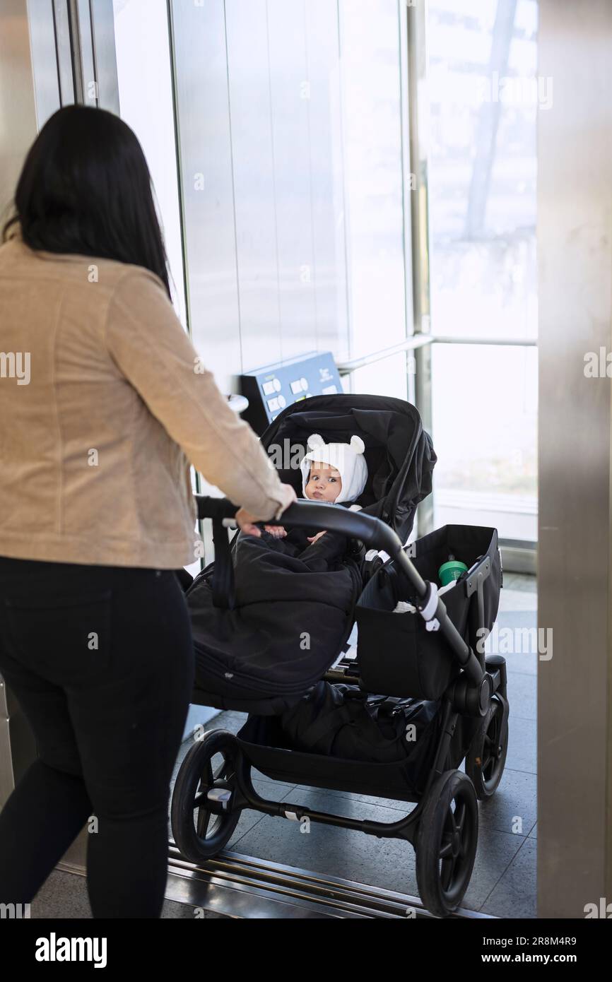 Woman pram rear view hi-res stock photography and images - Alamy