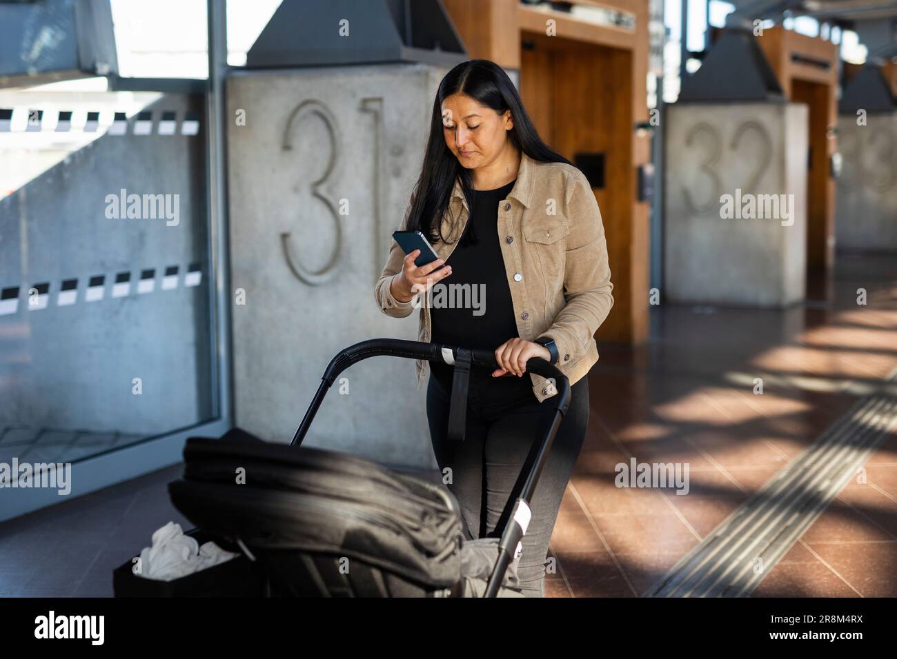 Woman pushing pram hi-res stock photography and images - Alamy
