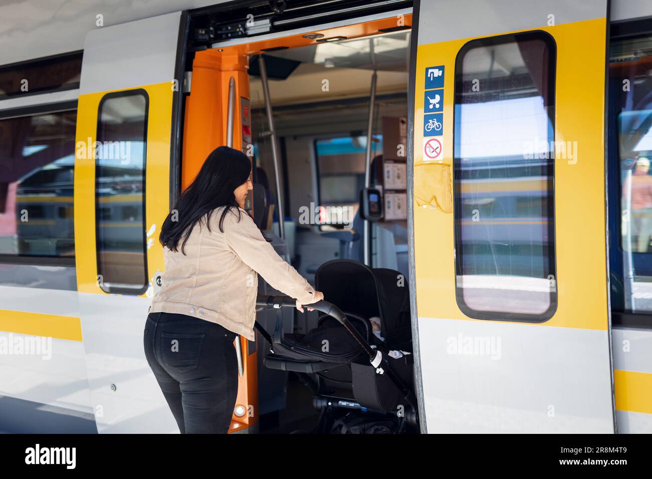 People person entering train hi-res stock photography and images - Alamy