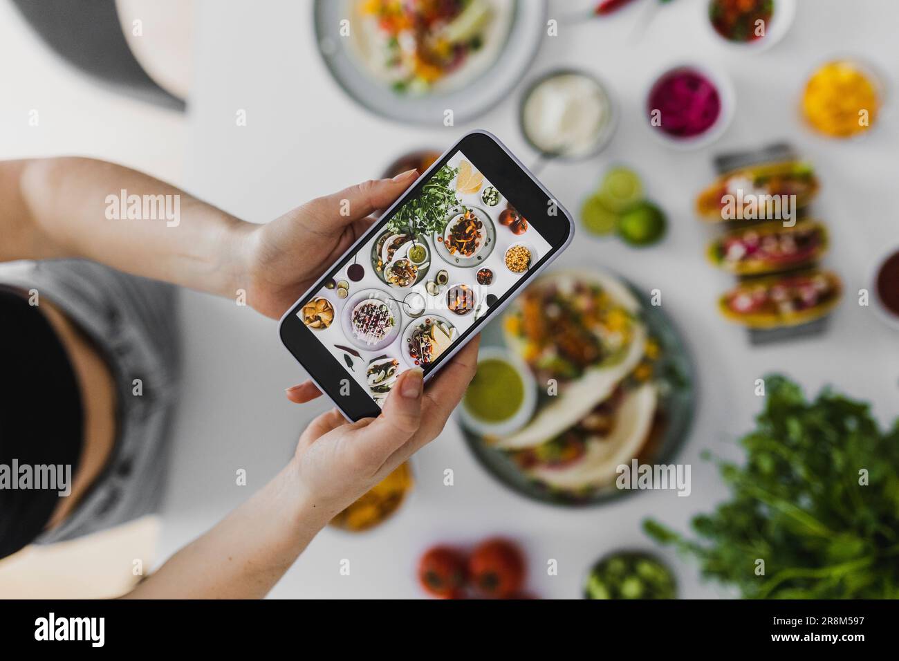 Person photographing healthy feast with various Mexican foods Stock ...