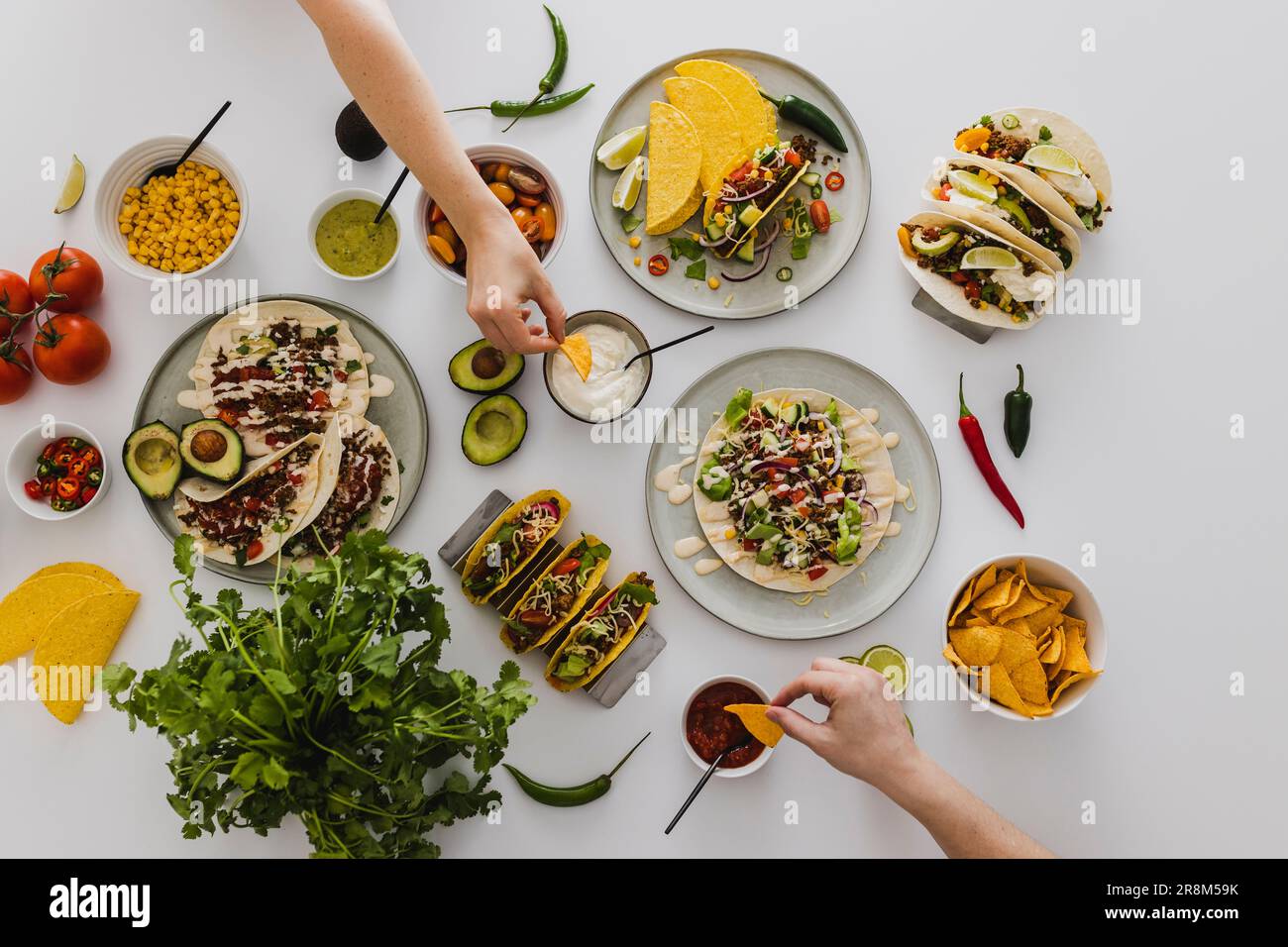 People sharing various healthy Mexican food Stock Photo - Alamy