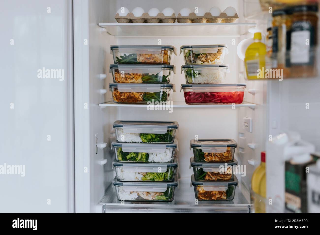 Fridge filled with lunch boxes as part of healthy meal prep Stock Photo ...