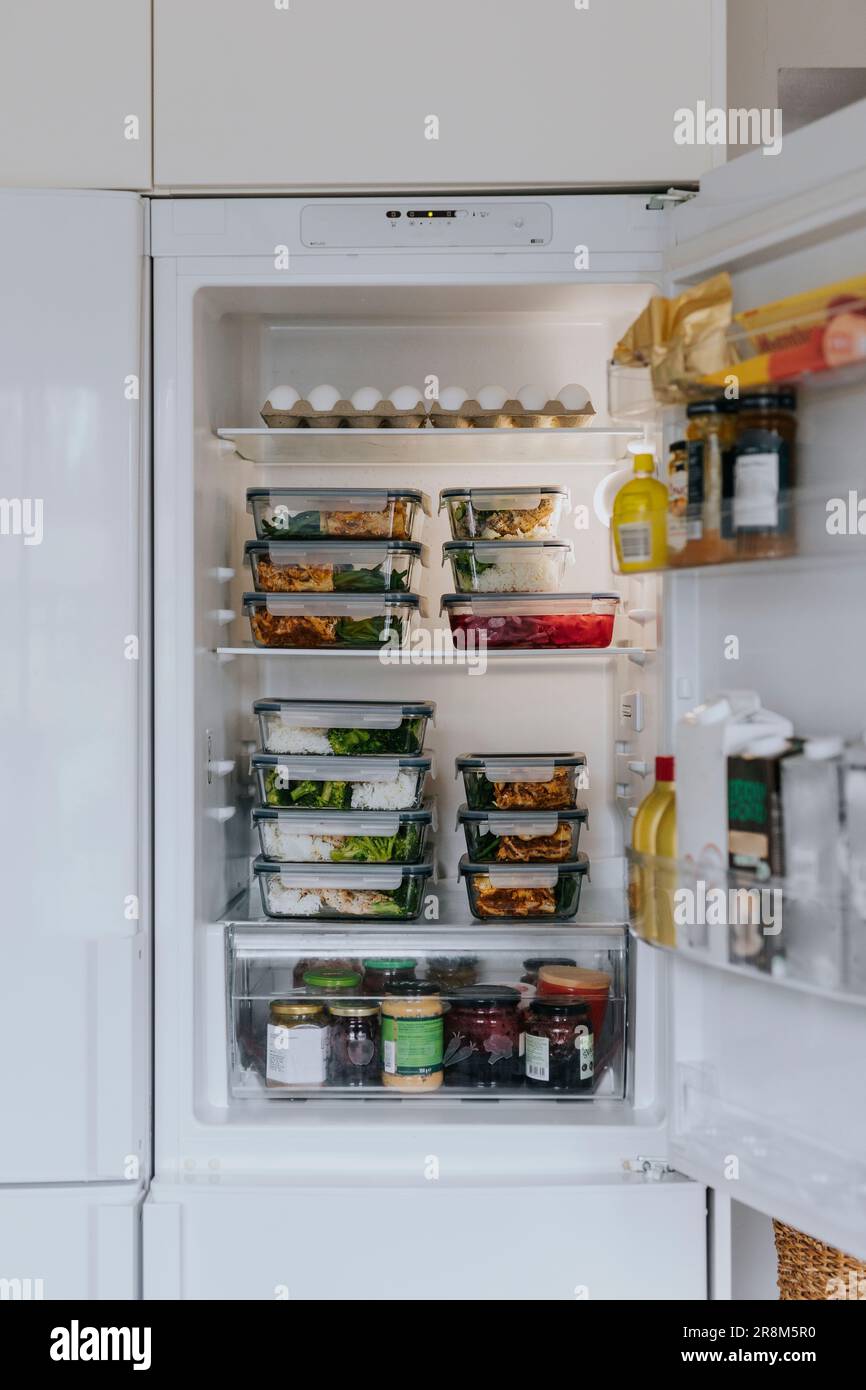 Fridge filled with lunch boxes as part of healthy meal prep Stock Photo ...